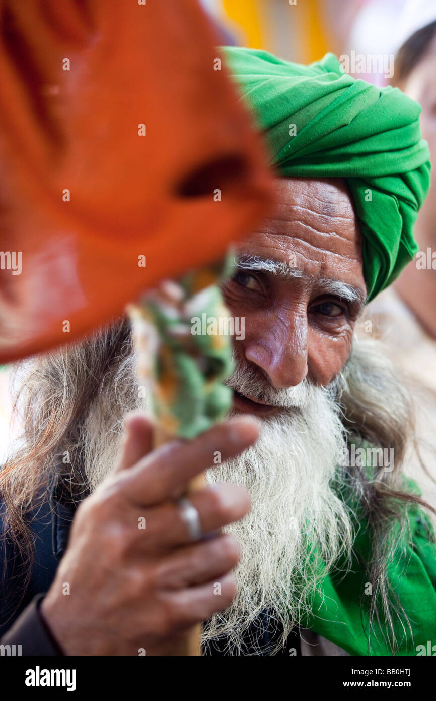 Old Muslim Man Fanning Worshippers at Nizamuddin Shrine in Delhi India ...