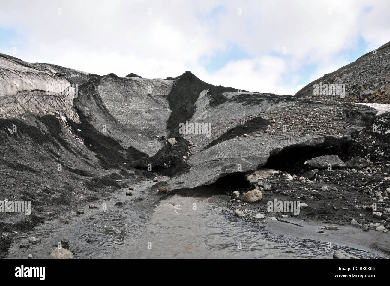 Meltwater streams emerging from sub-glacial ice tunnels at the terminus ...