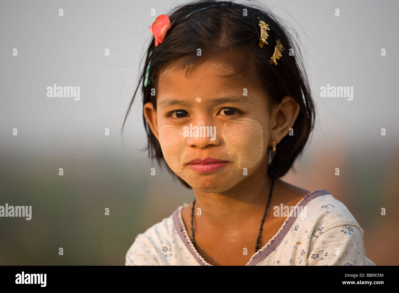 Girl with tanaka make up in Bagan, myanmar Stock Photo - Alamy