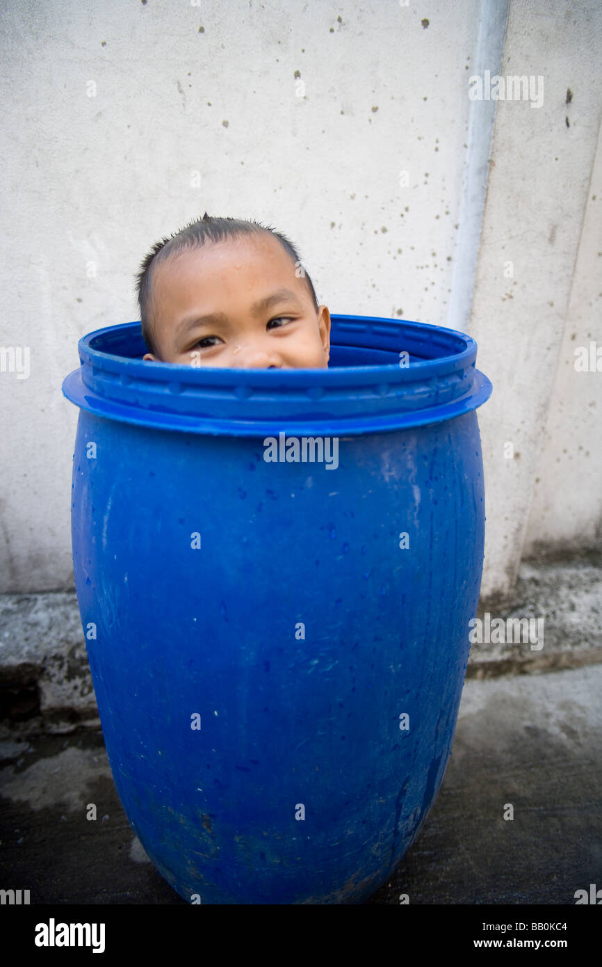 Boy in bucket during thai hi-res stock photography and images - Alamy