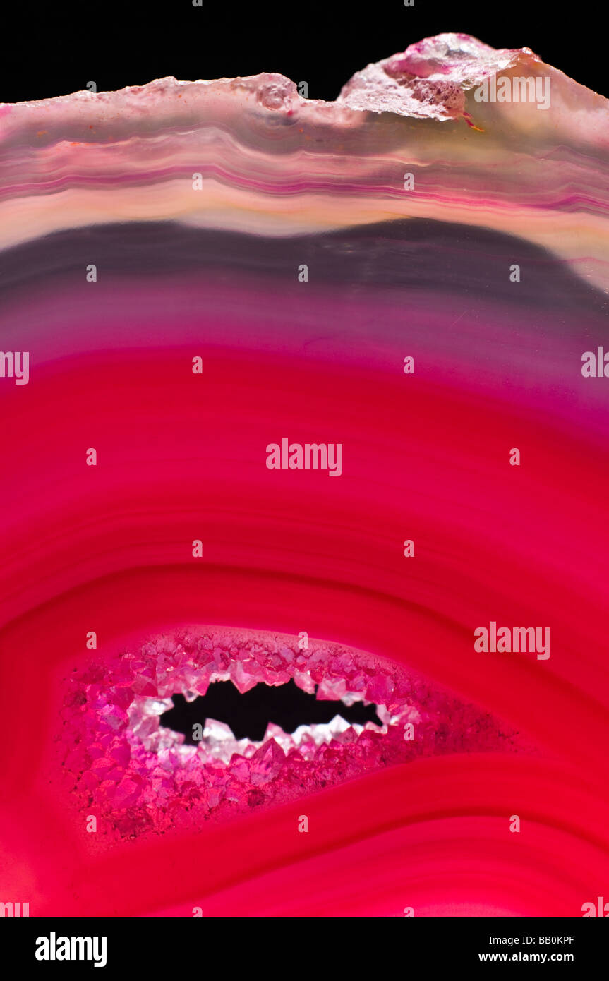 Red agate and crystals in slice from geode Stock Photo - Alamy