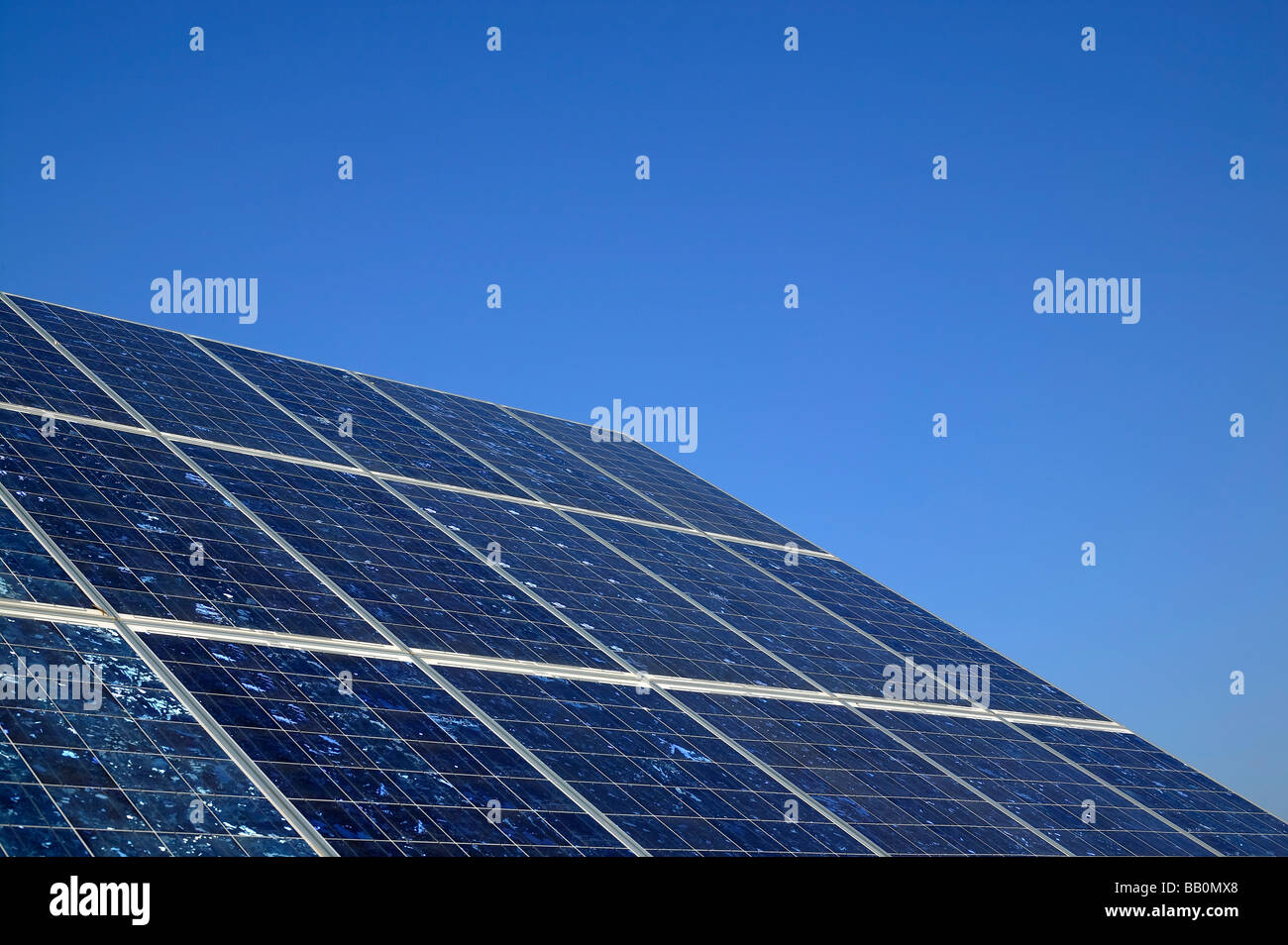 huge silicon solar panel with blue sky Stock Photo - Alamy