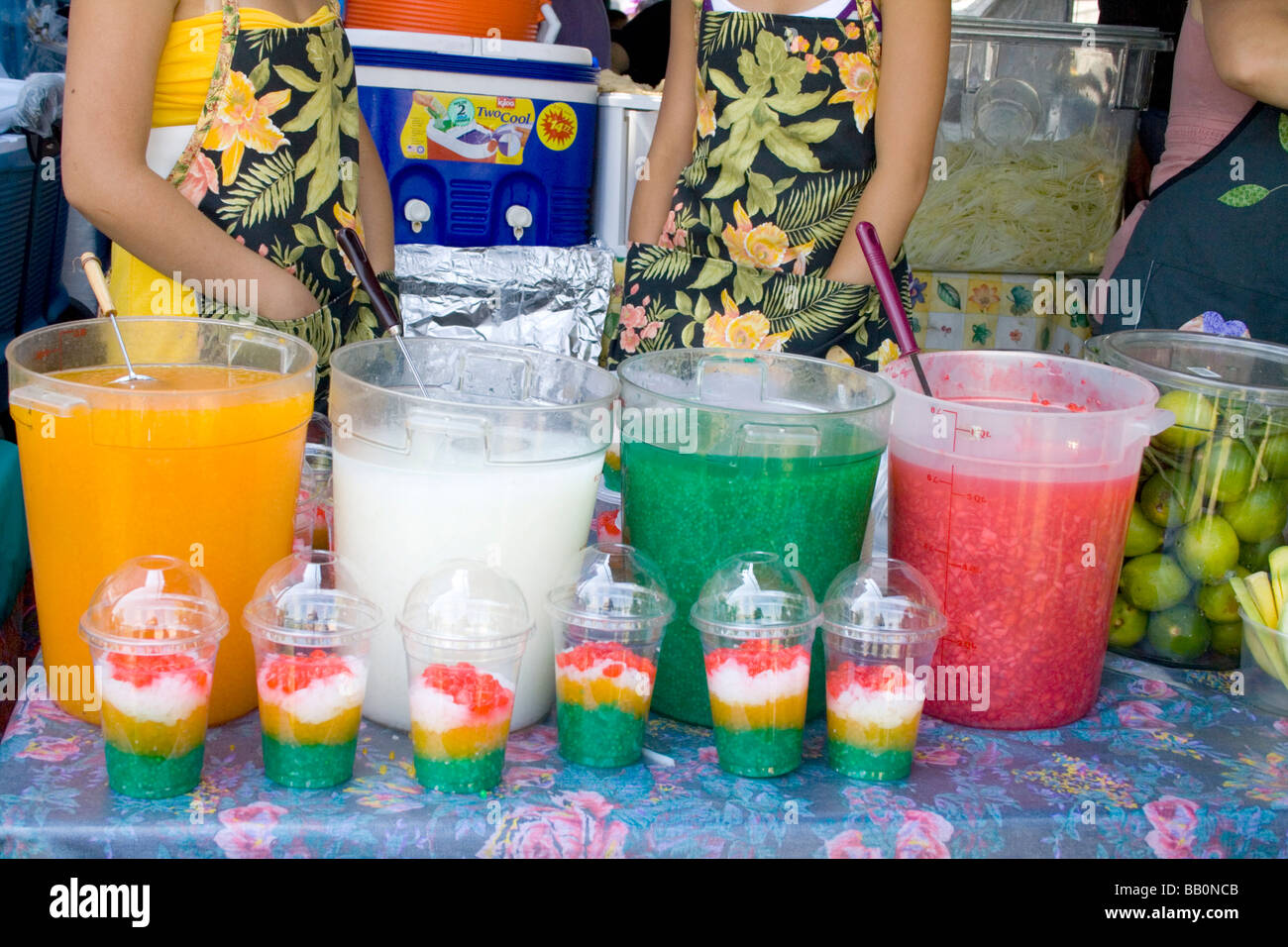 Hmong teenagers serving an array of multicolored fruit drinks. Hmong ...