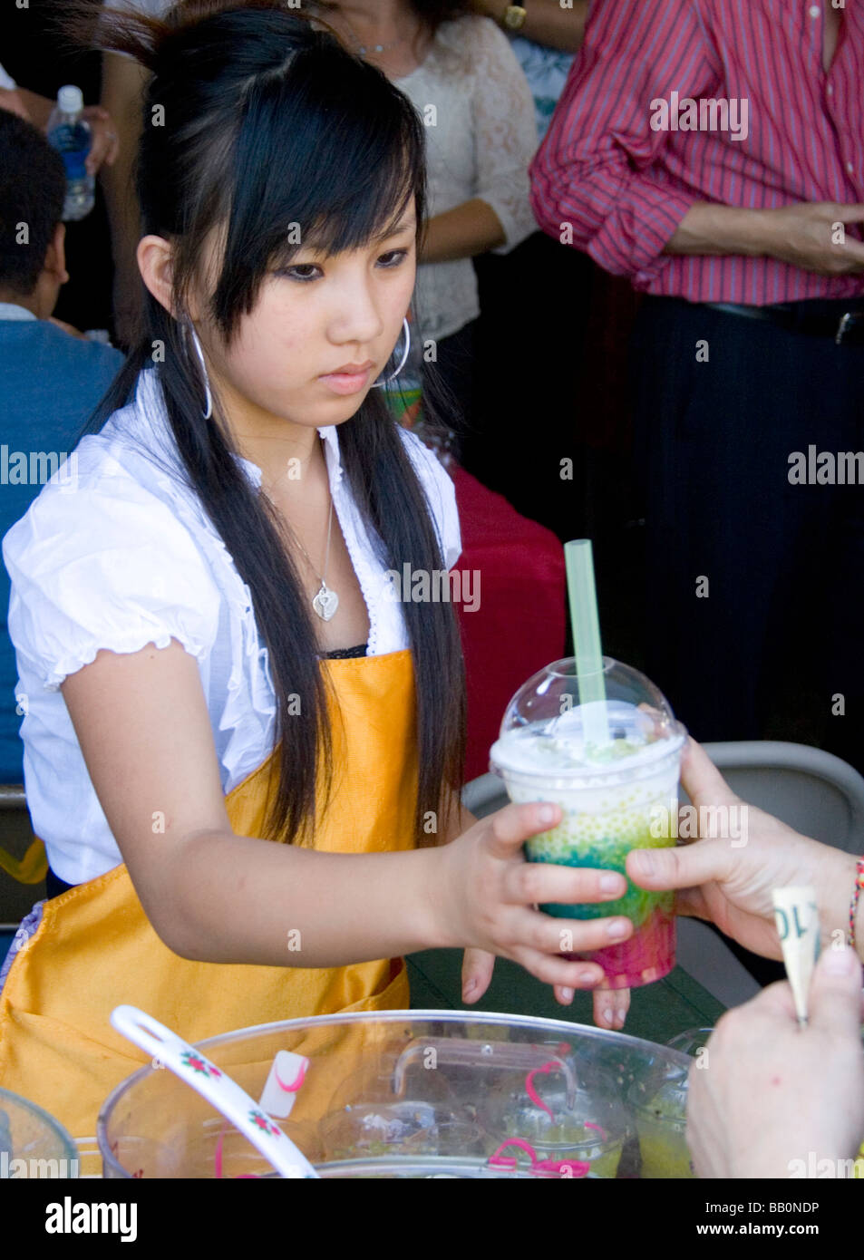 Hmong teen serving delicious three layer fruit drink. Hmong Sports ...