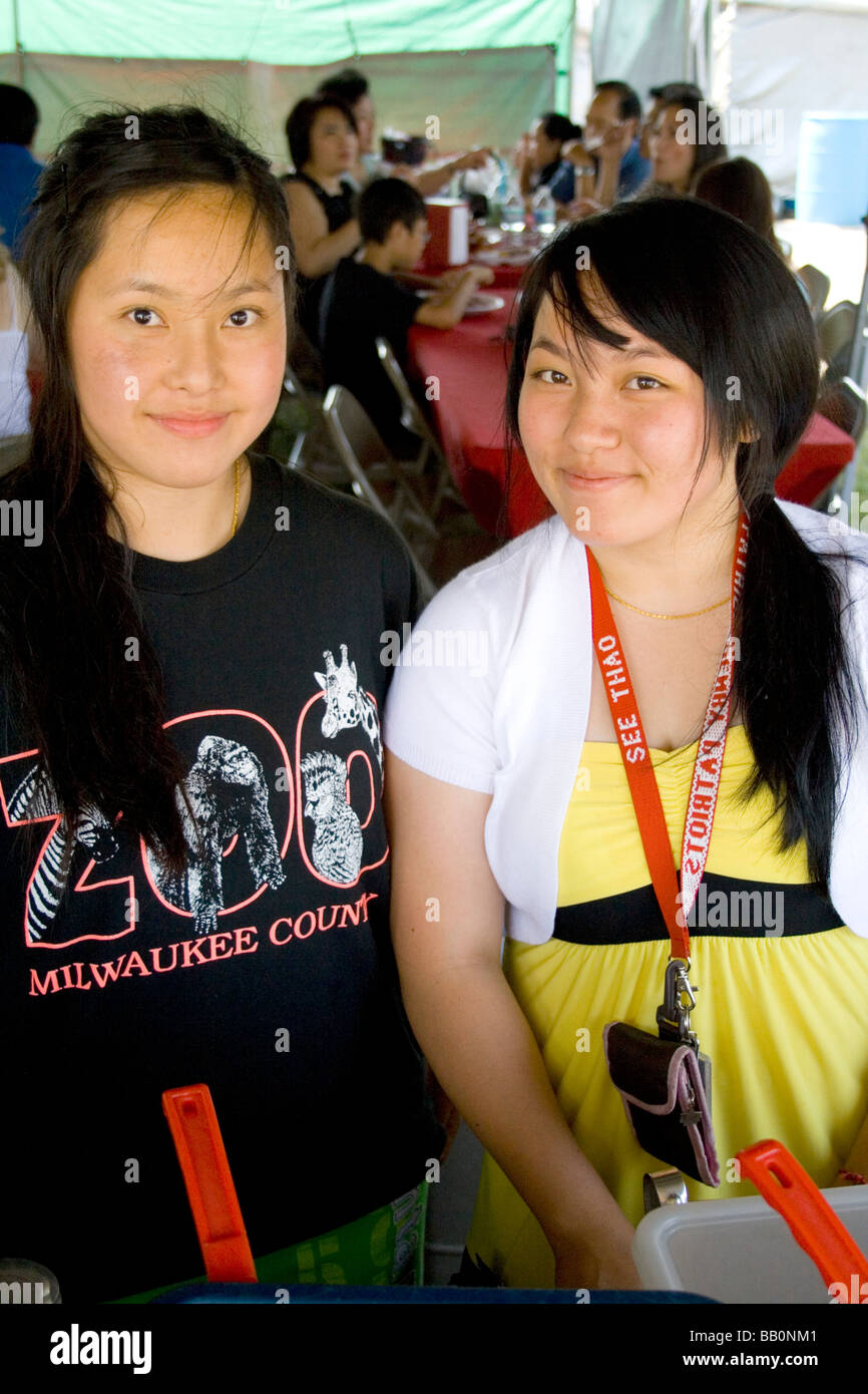 Happy Hmong SE Asian teenage women food servers. Hmong Sports Festival ...