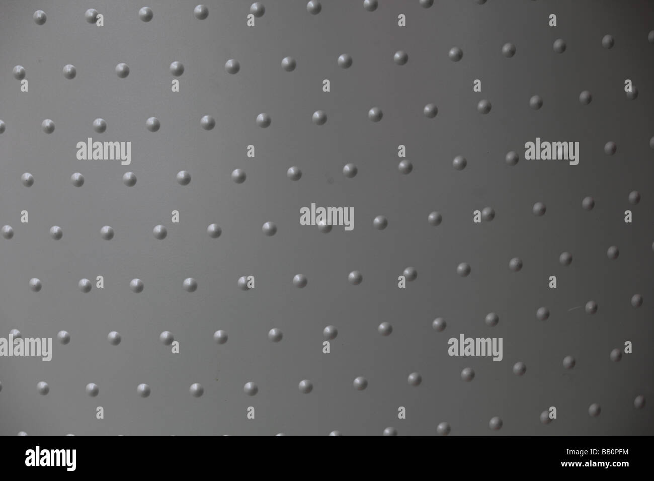 Textured metal with hexagonally pattered circular bumps Stock Photo - Alamy