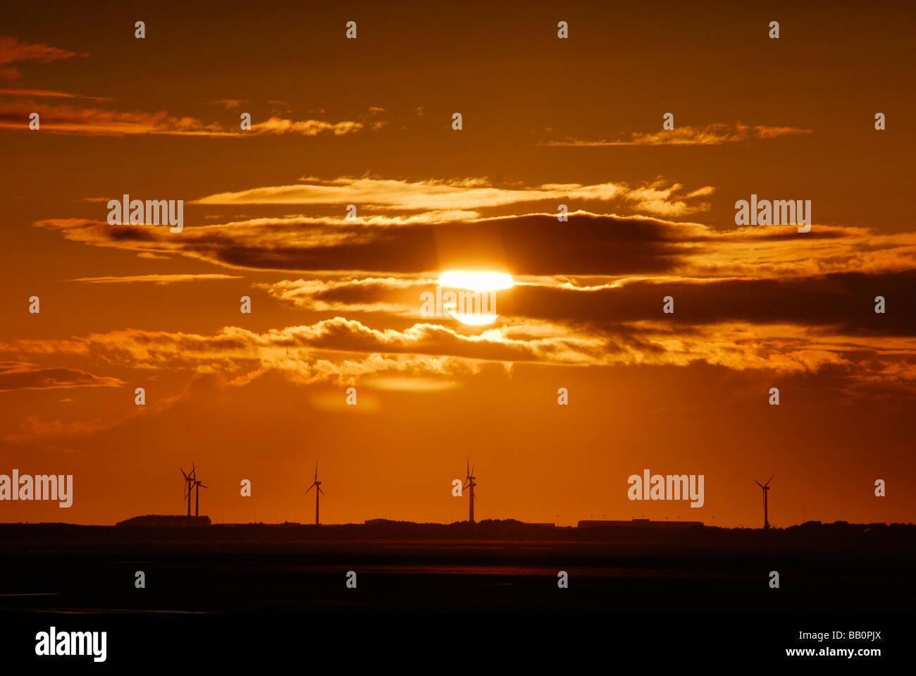 Sunset, wind turbines Stock Photo - Alamy