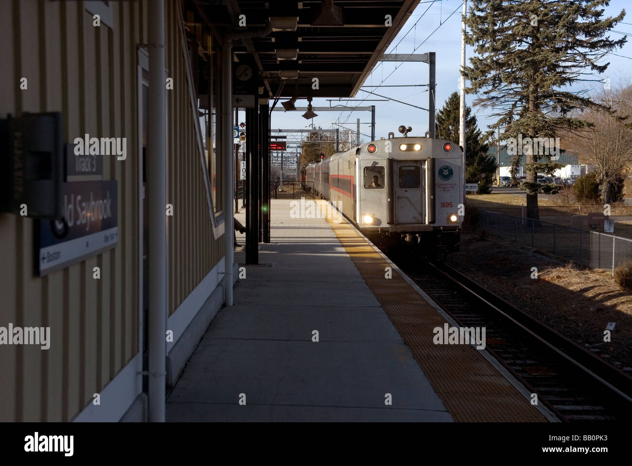 A commuter train drives at a Connecticut train station Stock Photo - Alamy