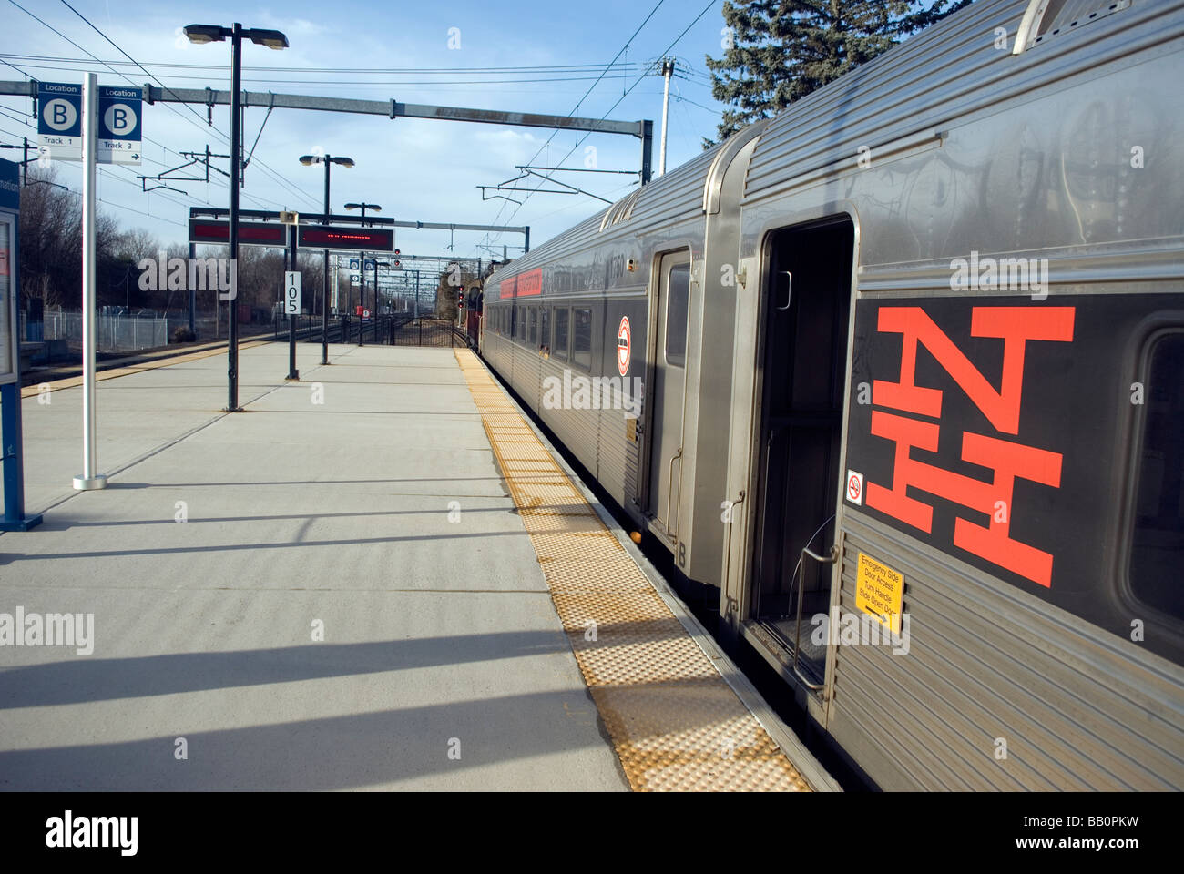A commuter train drives at a Connecticut train station Stock Photo - Alamy
