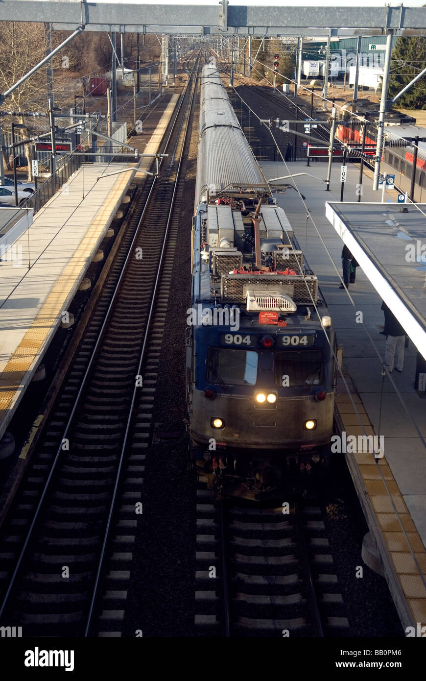 A commuter train drives at a Connecticut train station Stock Photo - Alamy