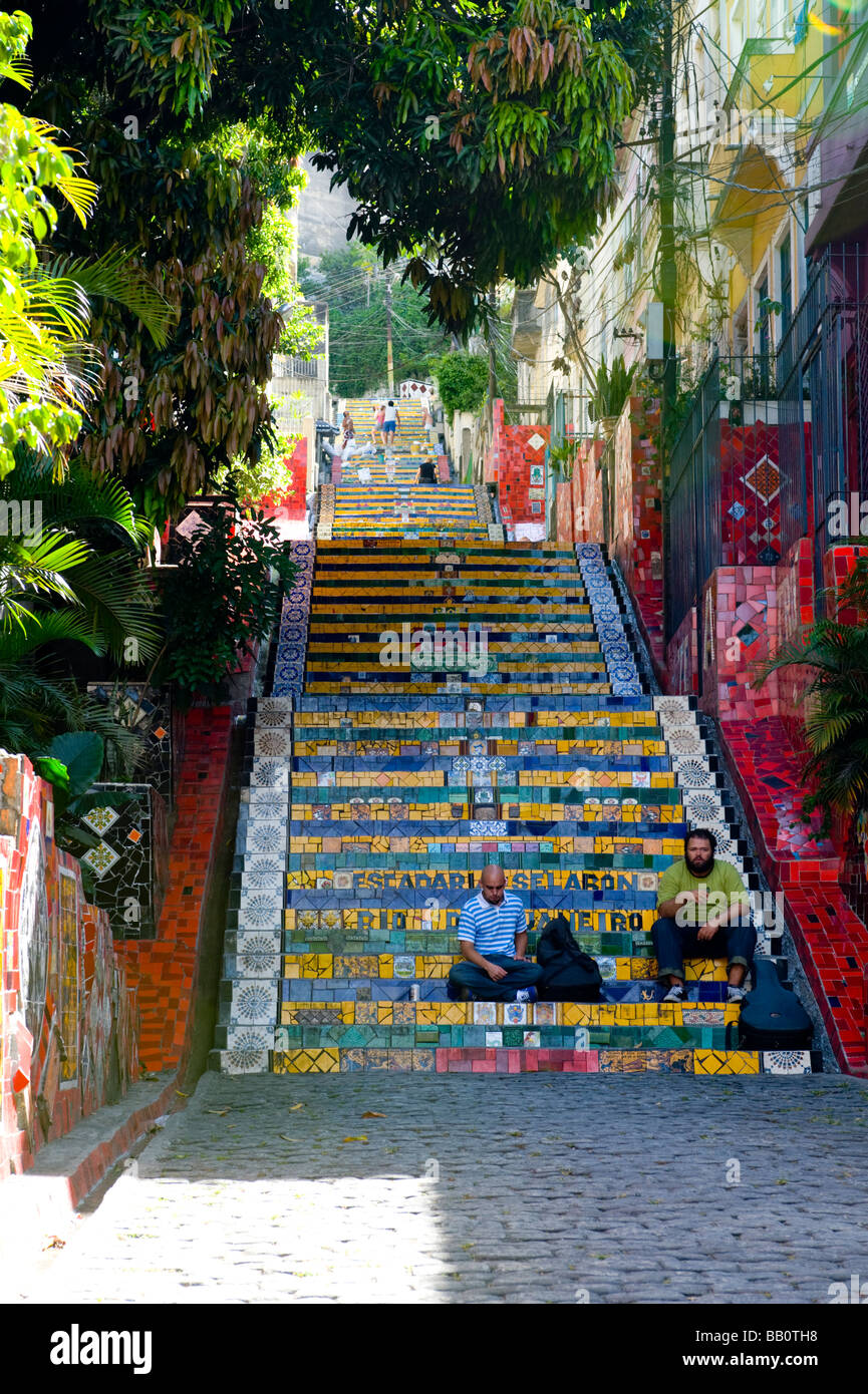 Locals sitting on the Escadaria Selaron stairs in Rio de Janeiro ...