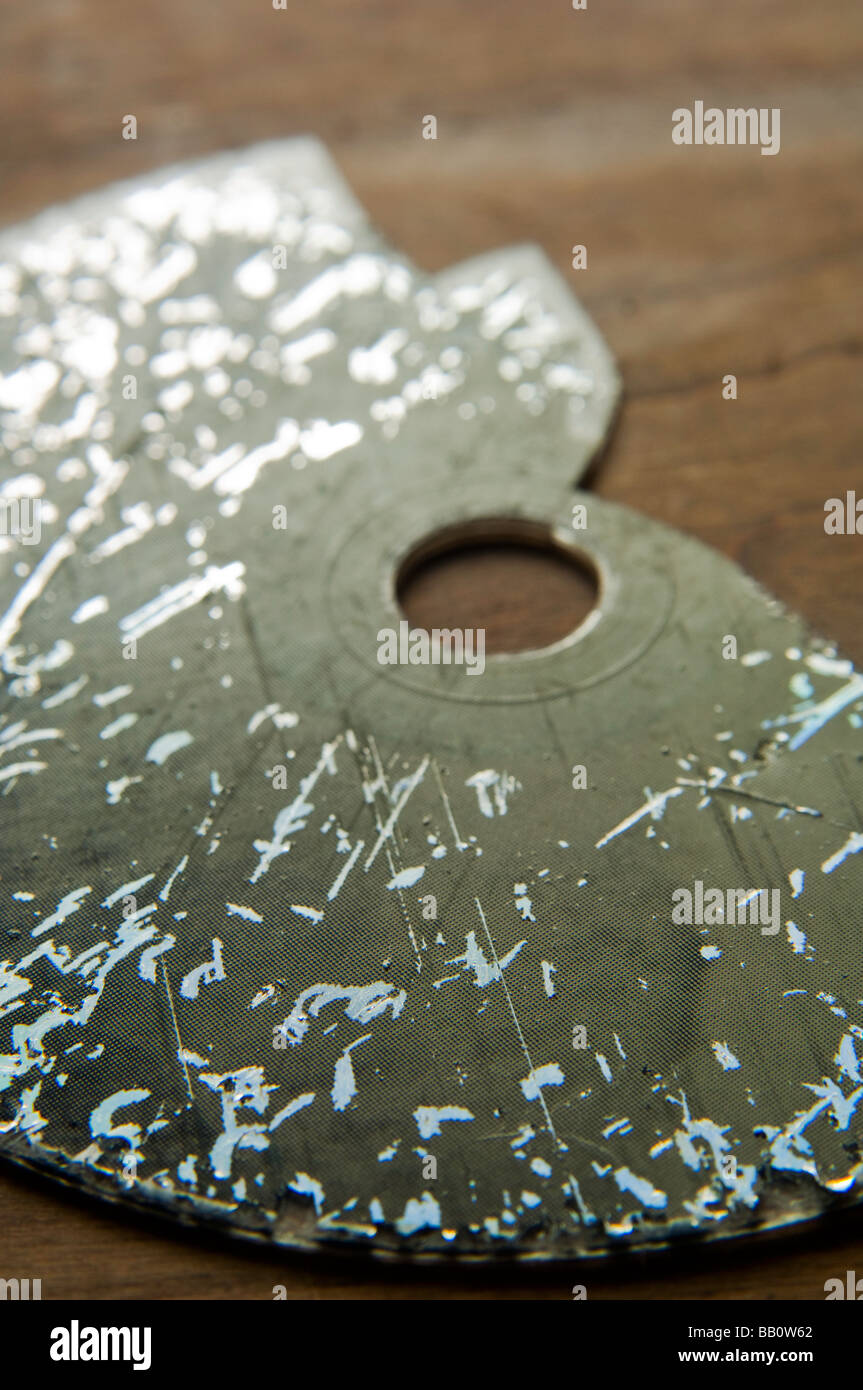 Battered and broken compact disc Stock Photo - Alamy