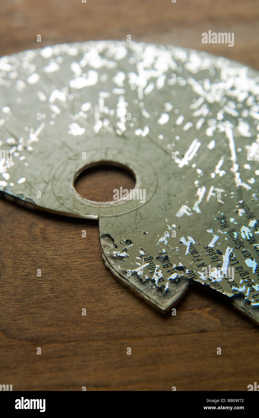 Battered and broken compact disc Stock Photo - Alamy