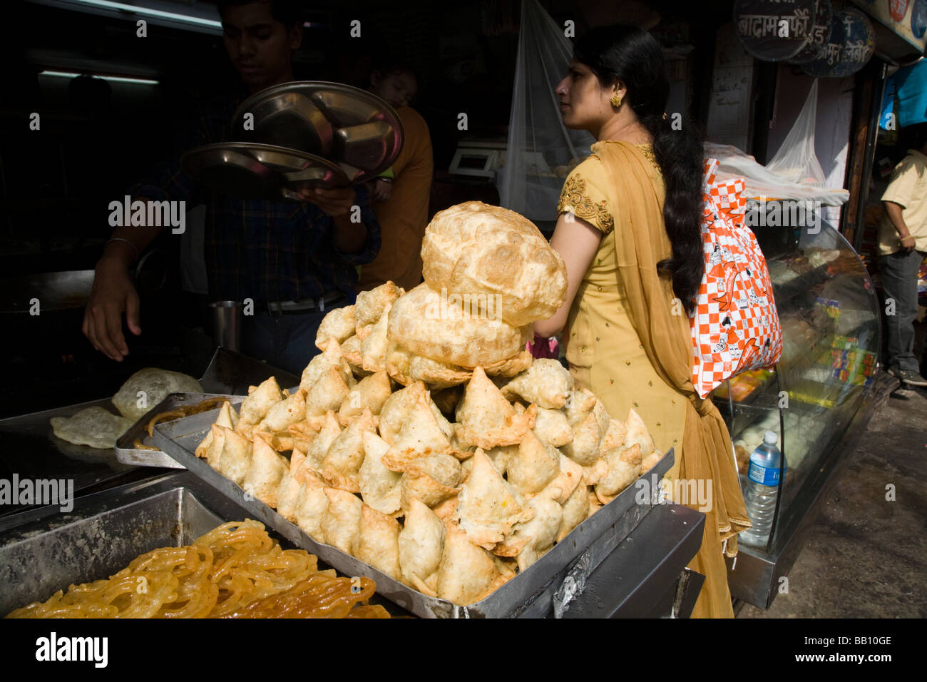Small shop selling indian snack foods – puri / poori and samosas – to ...