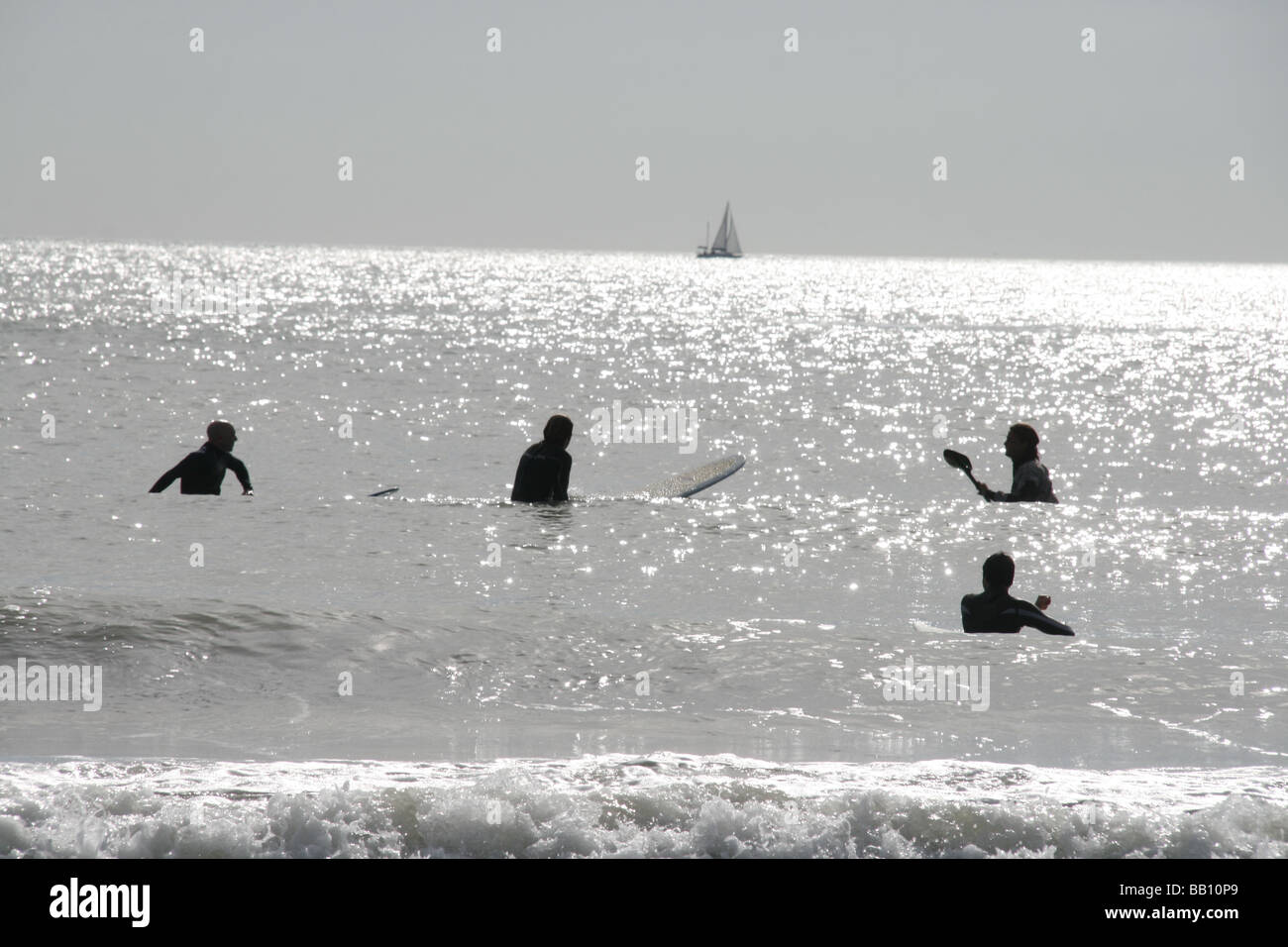 Two surfers in wet suits hi-res stock photography and images - Alamy