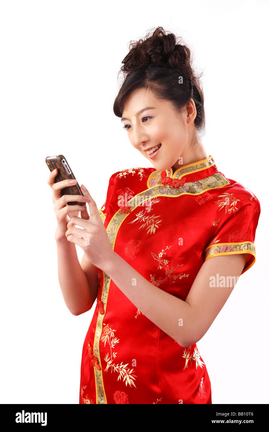 Chinese woman dressing in traditional clothing calling Stock Photo - Alamy