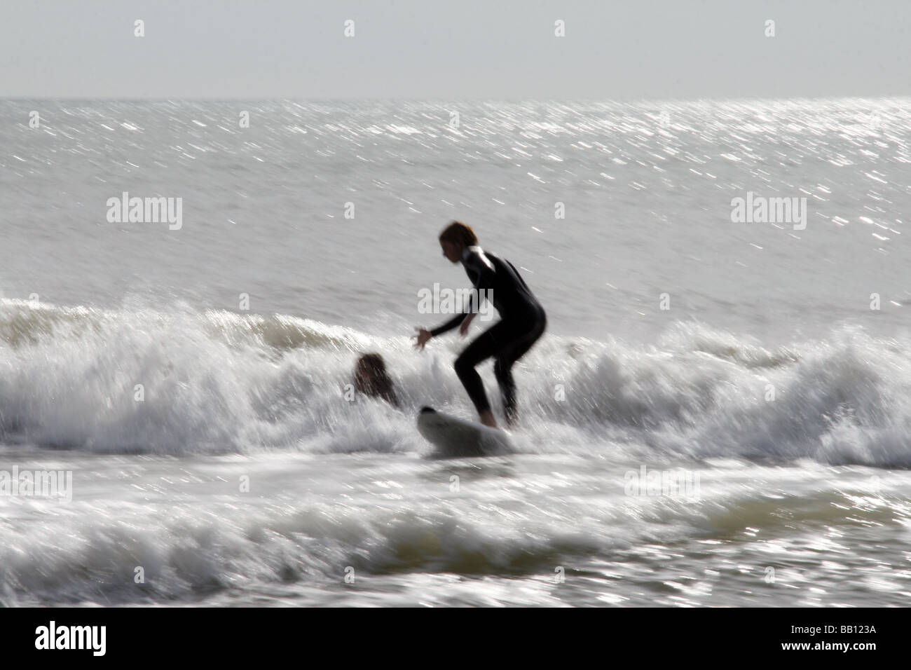 Riding surfer wearing wetsuit hi-res stock photography and images - Alamy