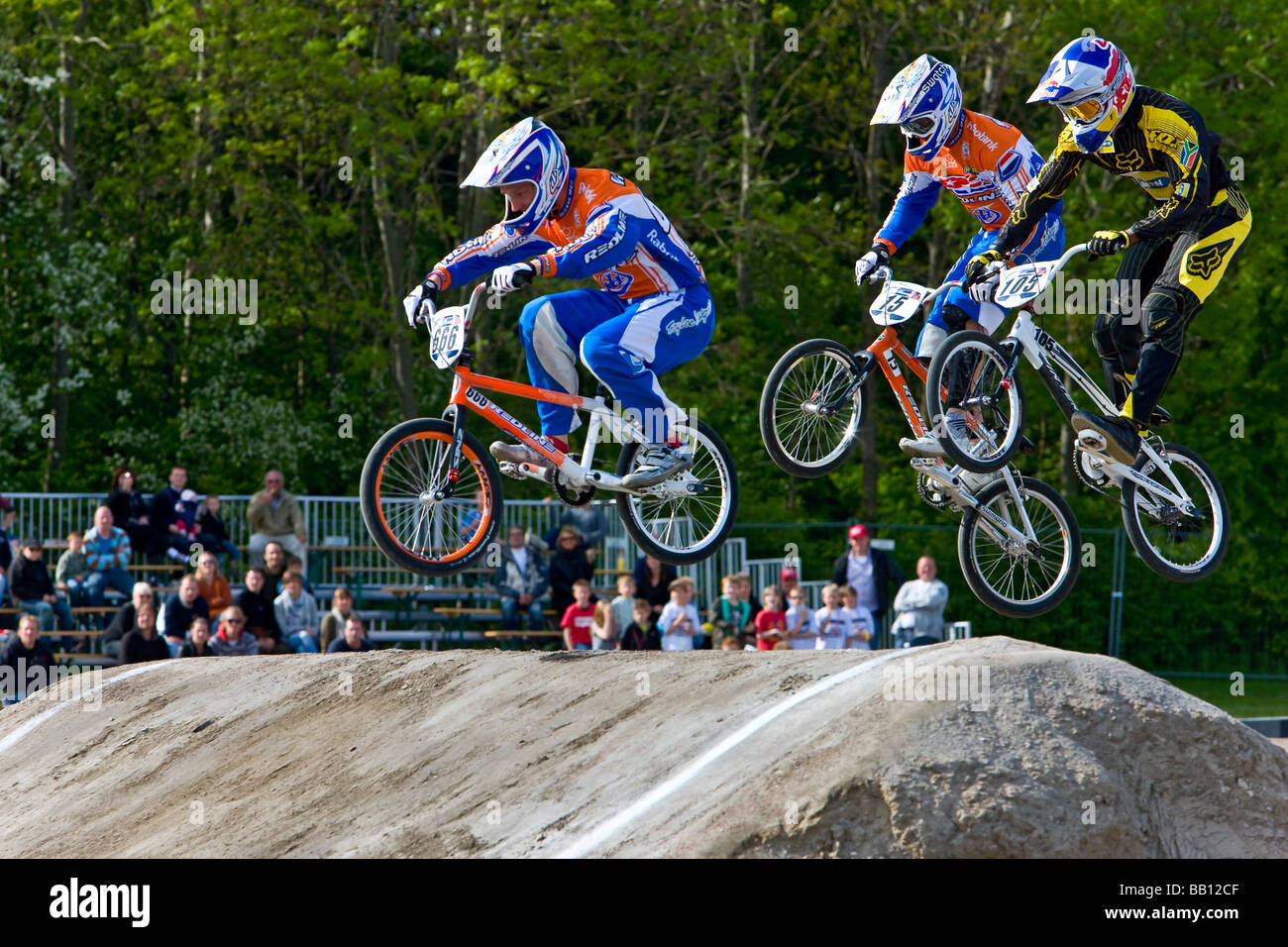 Three jumping competitors at the BMX Supercross World Cup Stock Photo ...