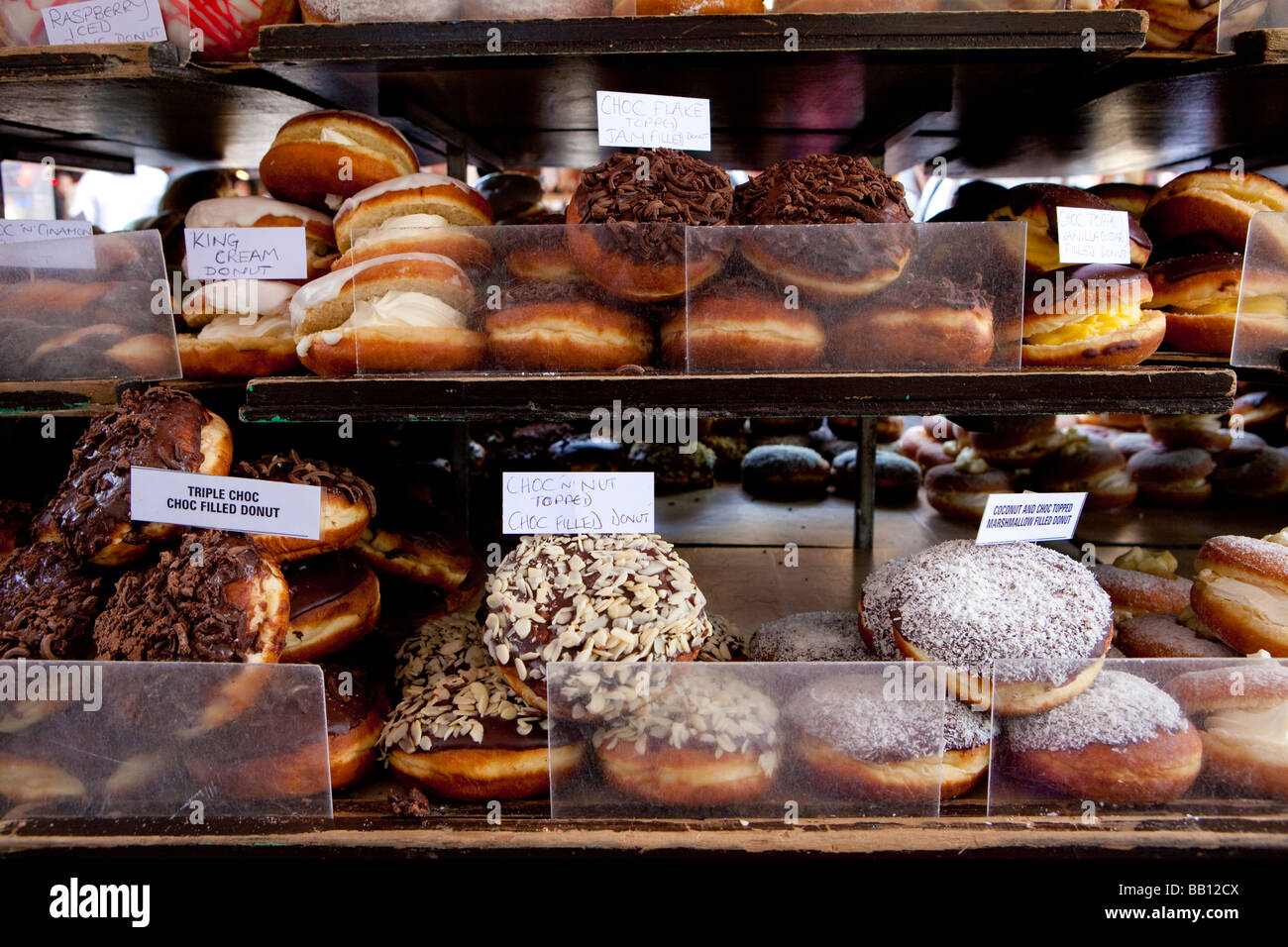 Doughnuts for sale on a market stall in Campden, London Stock Photo - Alamy