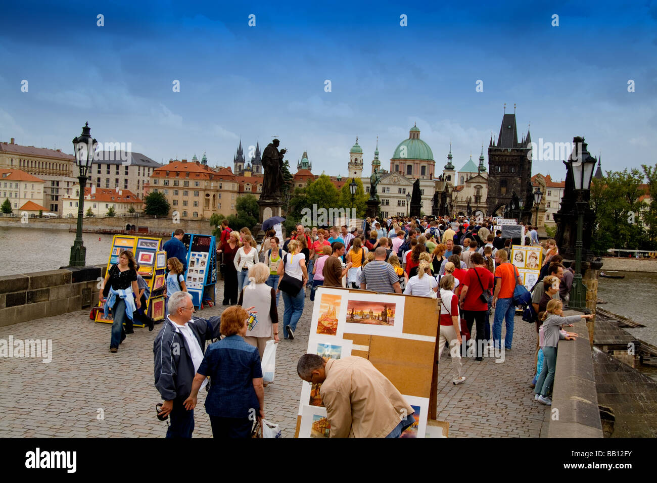 Crowds and artists on the famous Charles Bridge of tourist city of ...