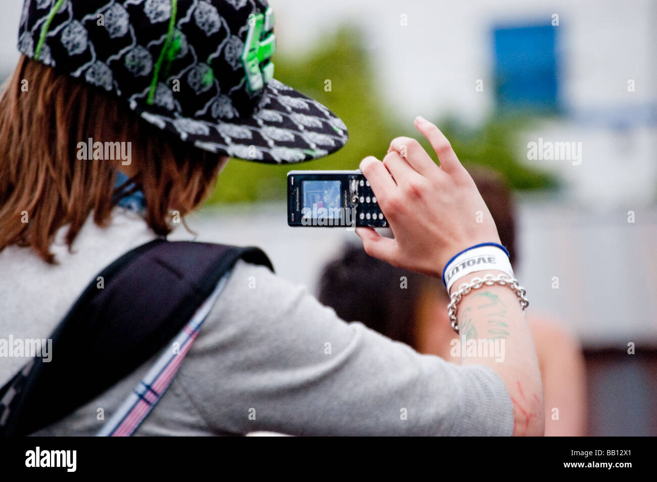 A young girl takes a photograph using her mobile phone camera Stock ...