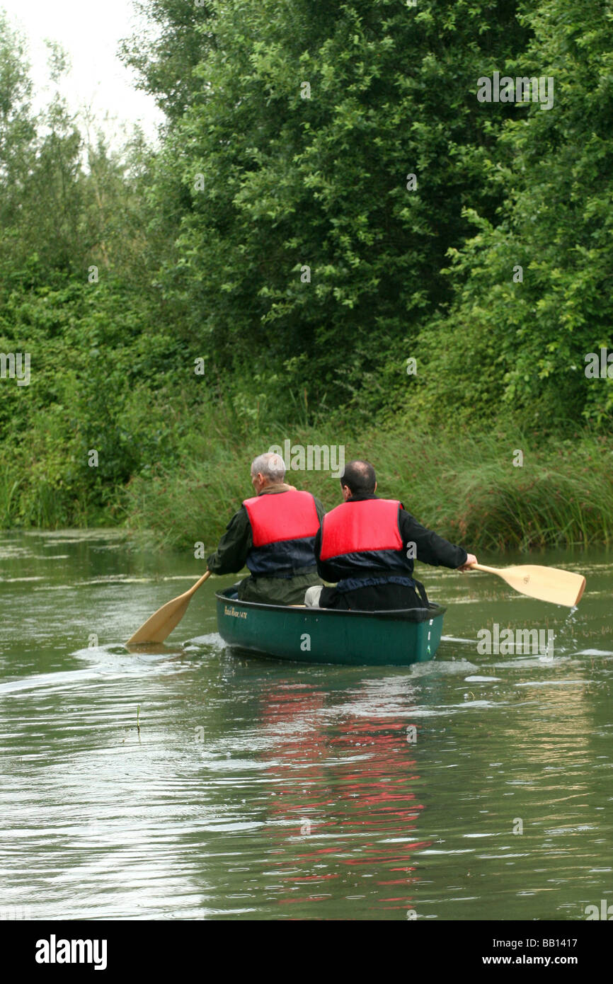 Canoe in the rain Stock Photo - Alamy