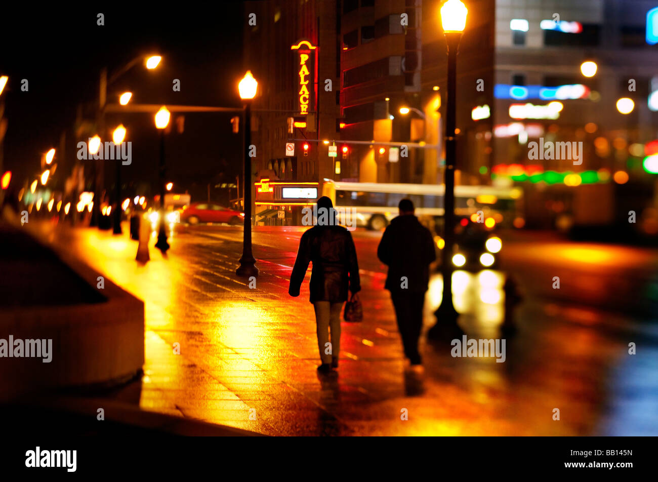 Two People Walking In The Street
