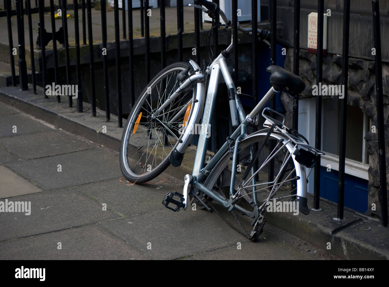 Abandoned bicycle with back wheel missing, presumed stolen Stock Photo ...
