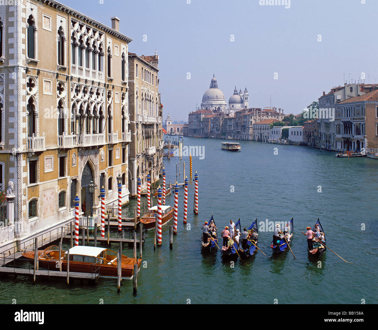 The Grand Canal with gondoliers, Venice, Italy Stock Photo - Alamy