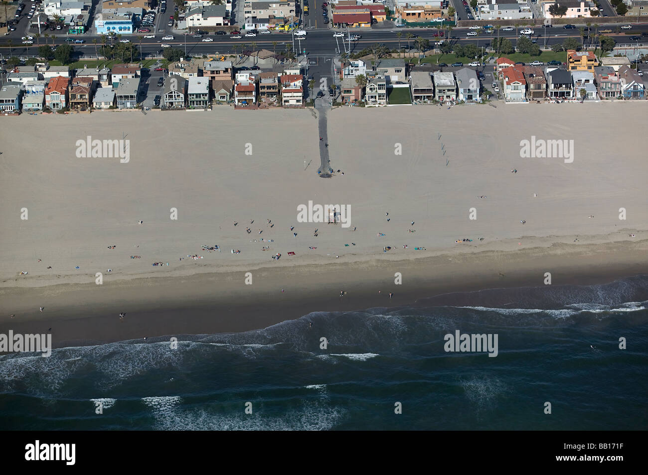 aerial view above southern California Pacific ocean beach front houses ...
