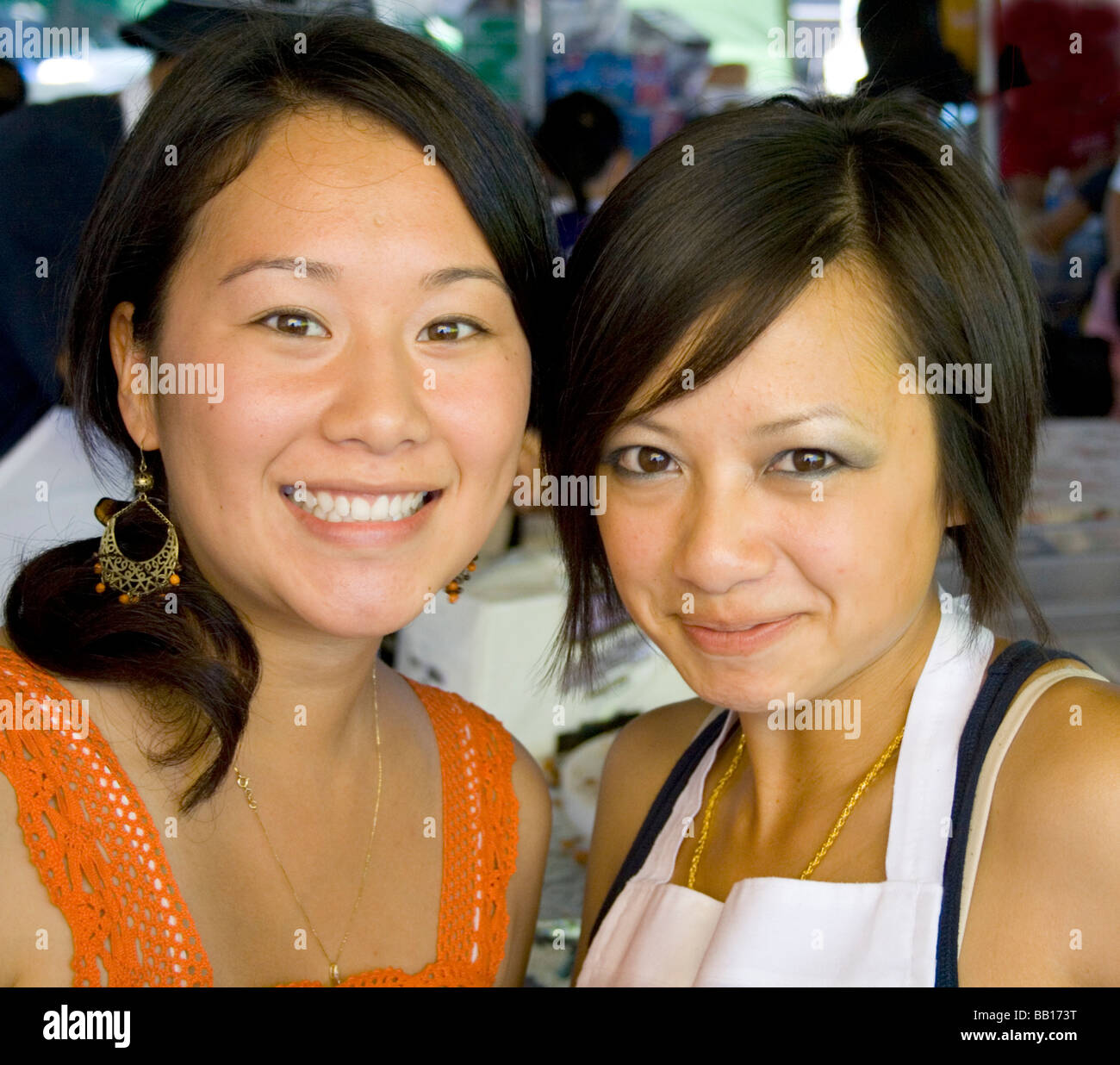 Two happy beautiful Hmong restaurant workers. Hmong Sports Festival ...