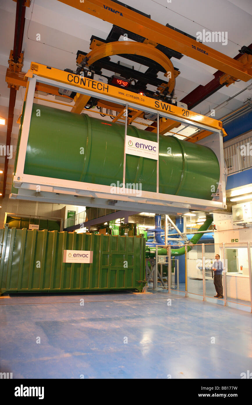 envac waste container held in crane at a transfer station Stock Photo ...