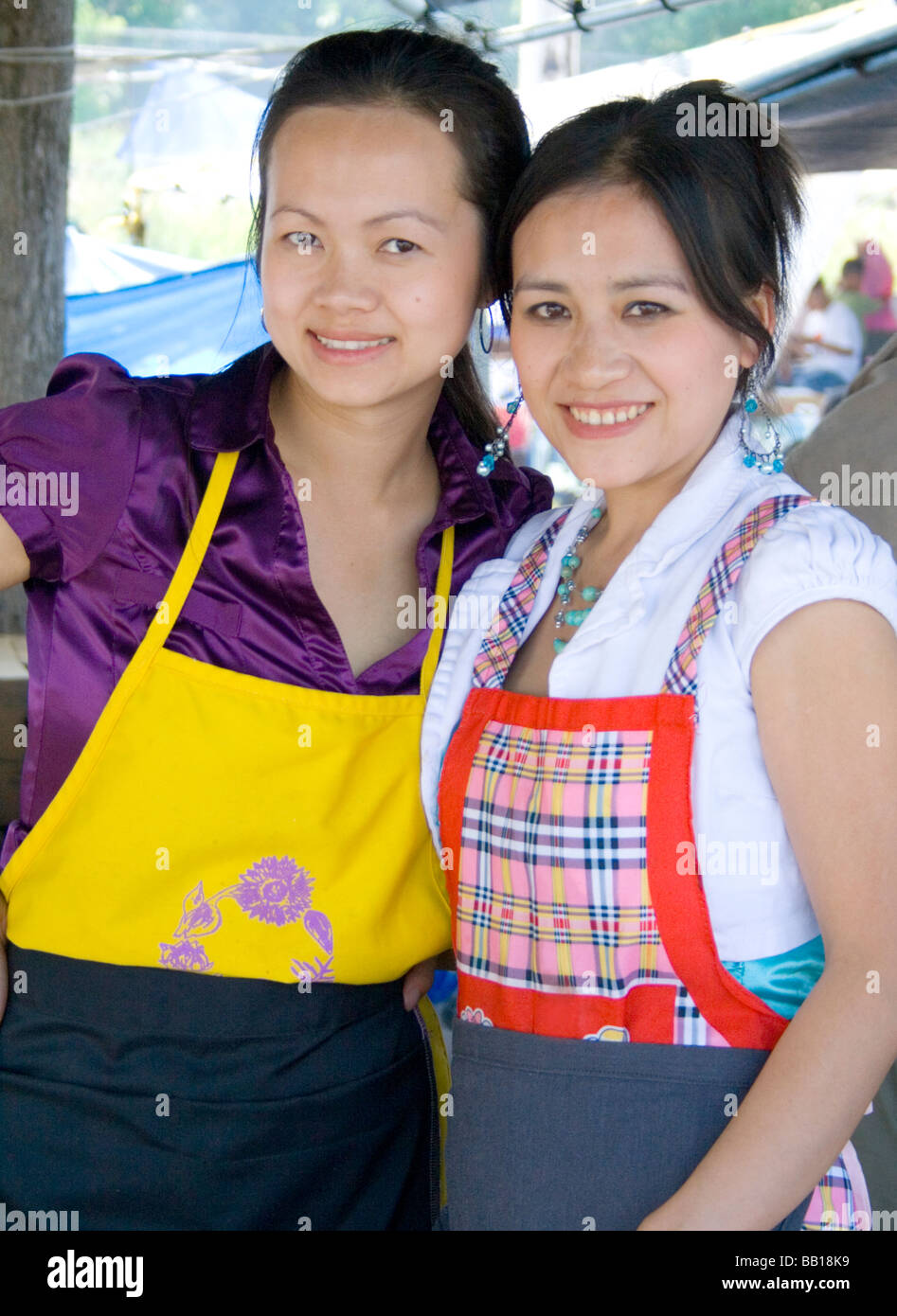 Two kitchen workers in a Hmong outdoor restaurant, Hmong Sports ...