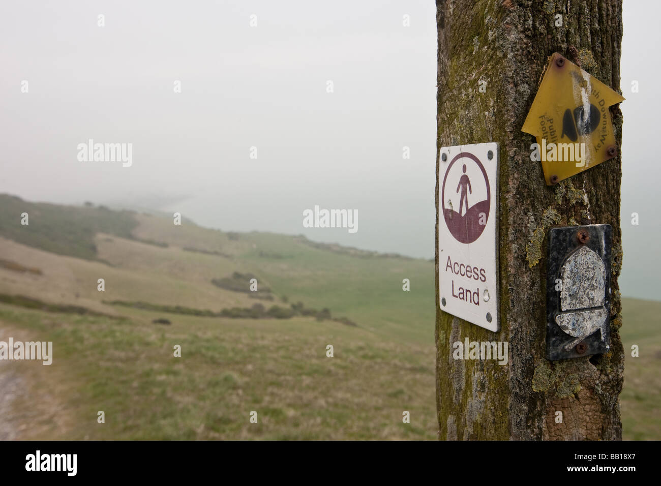 Walking way marker post arrow access land Stock Photo - Alamy