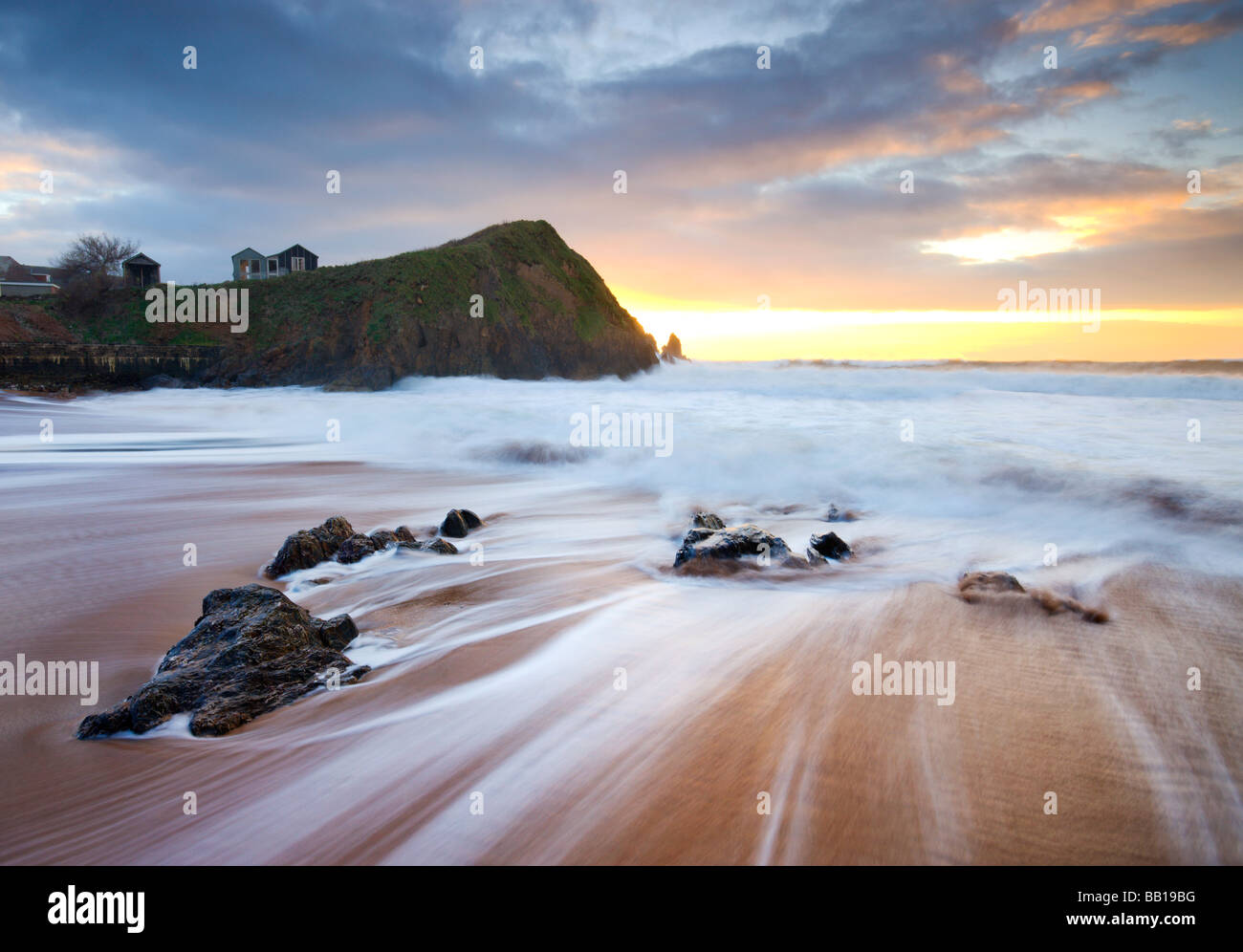 Incoming waves at sunset Hope Cove South Hams Devon England January ...