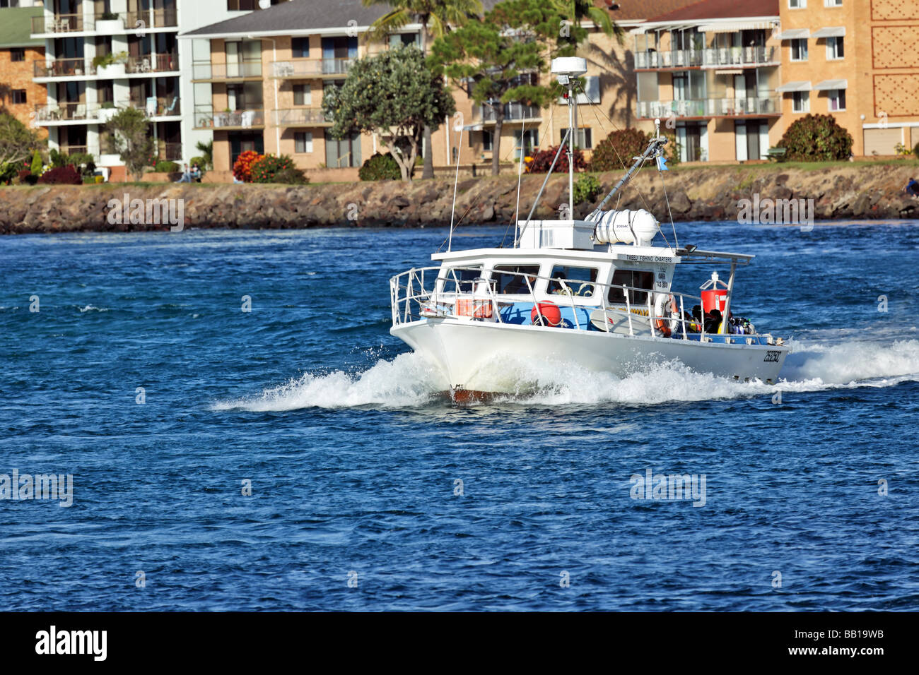 Fishing Trawler navigating a waterway Stock Photo - Alamy