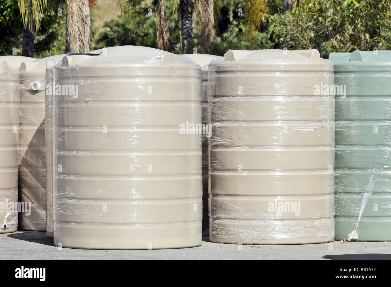 Plastic rain water tanks ready for distribution Stock Photo - Alamy