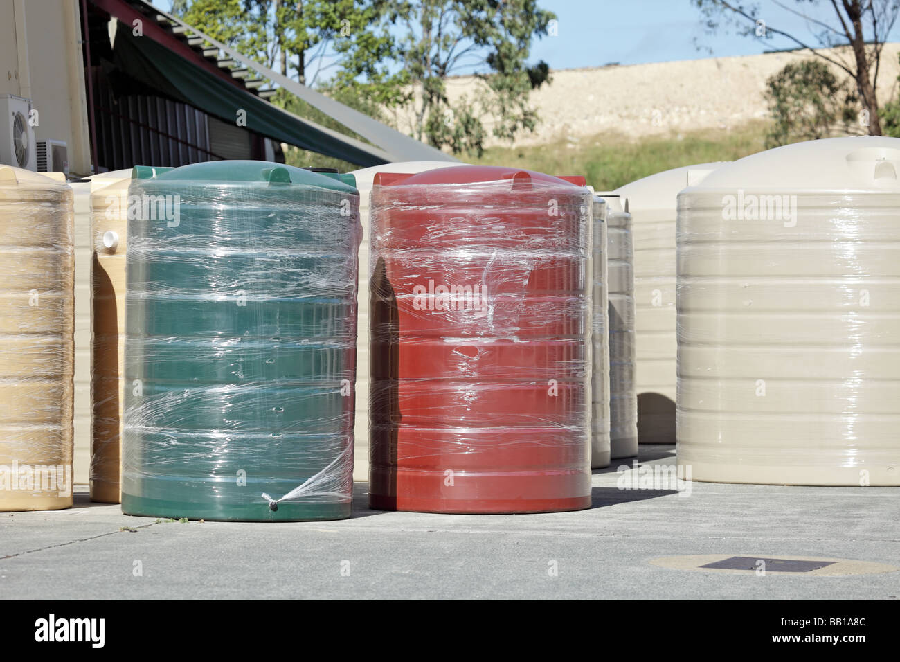 Plastic rain water tanks ready for distribution Stock Photo - Alamy