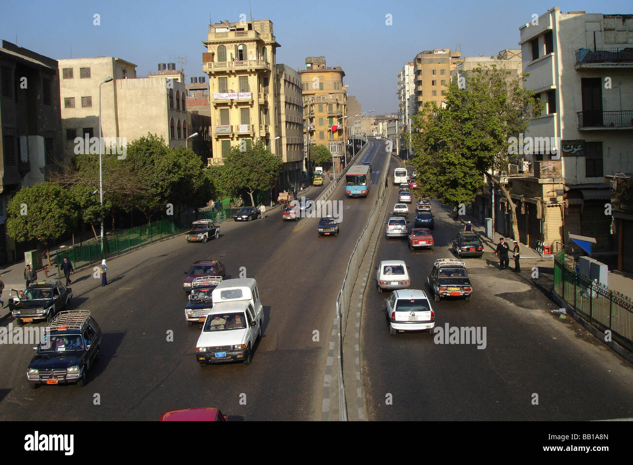 EGYPT, Cairo. Large express way and cars fringed with buildings and ...