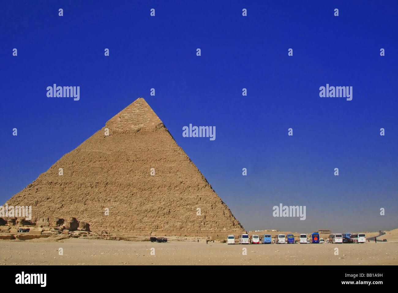 EGYPT, Giza. Big tourist buses parked at the feet of the pyramids in ...