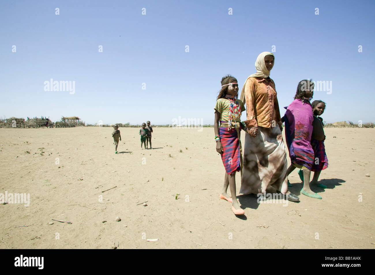 Family walking near their village, Afar tribe, Awash Fontale, Ethiopia ...