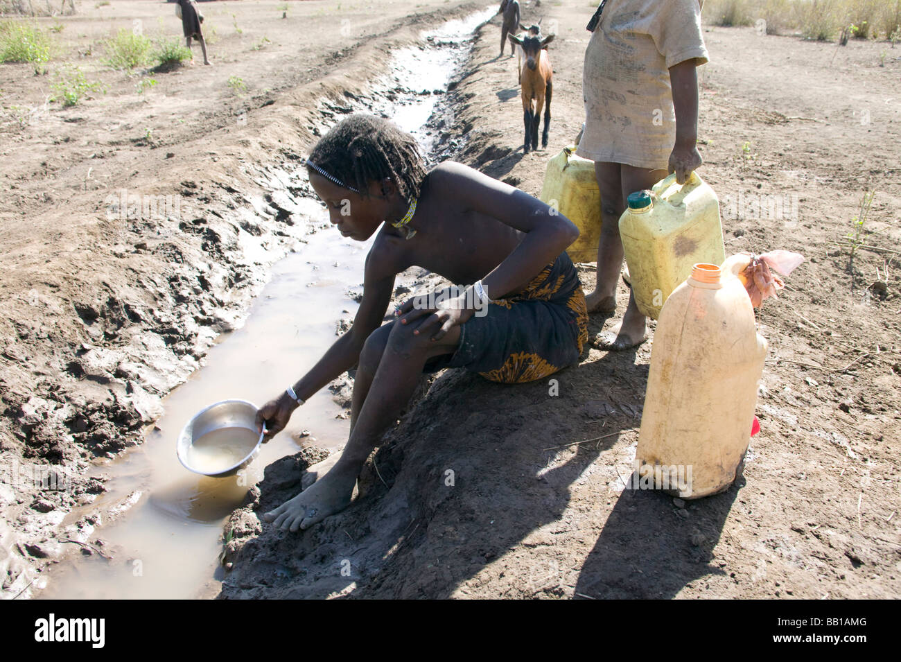 Man getting water from ditch built by CARE to bring water to drought ...