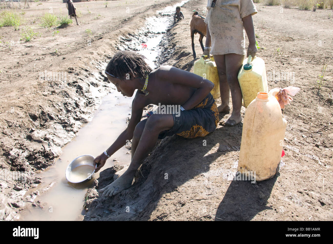 Man getting water from ditch built by CARE to bring water to drought ...