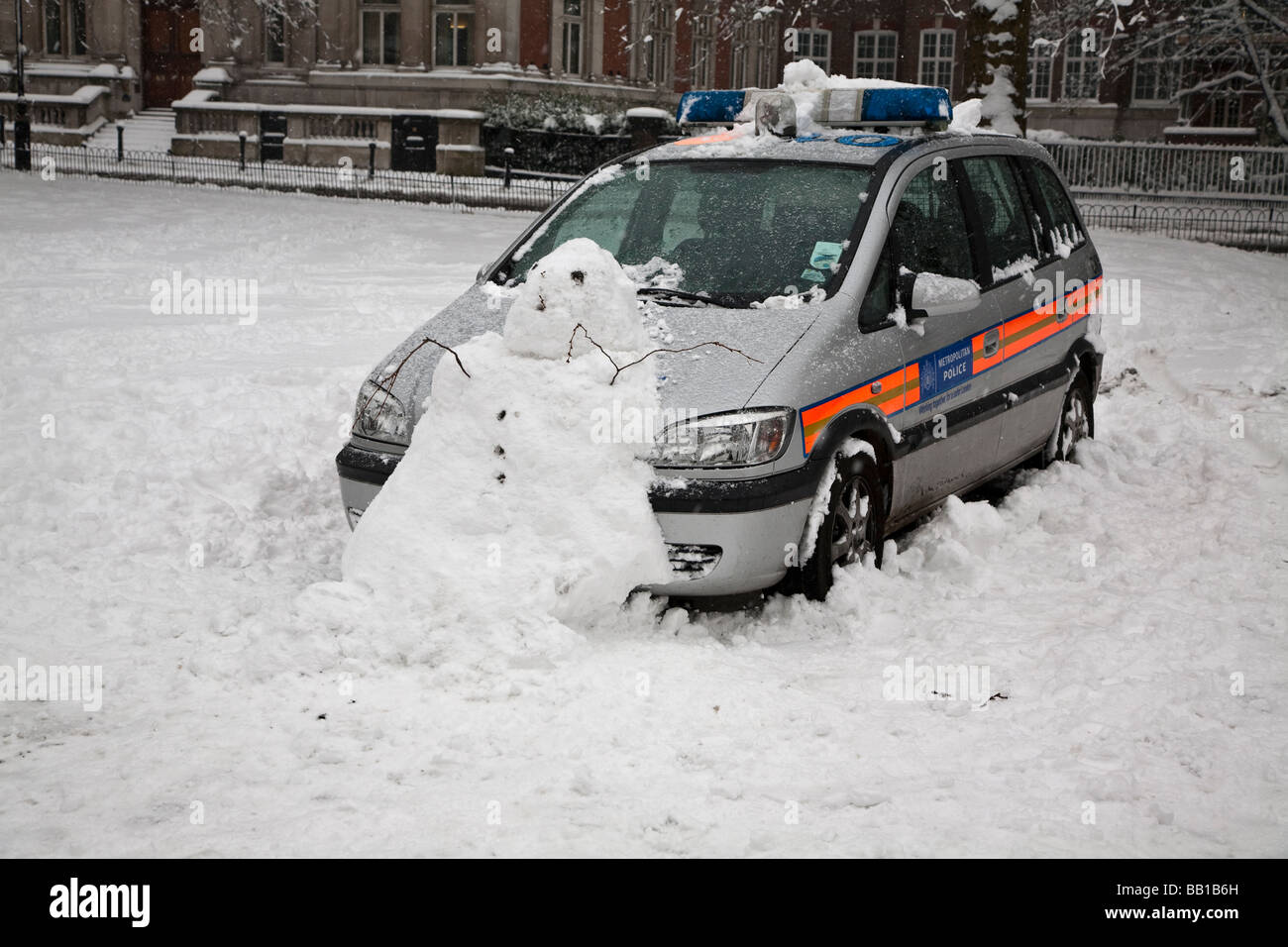 Police car and snowman Stock Photo - Alamy