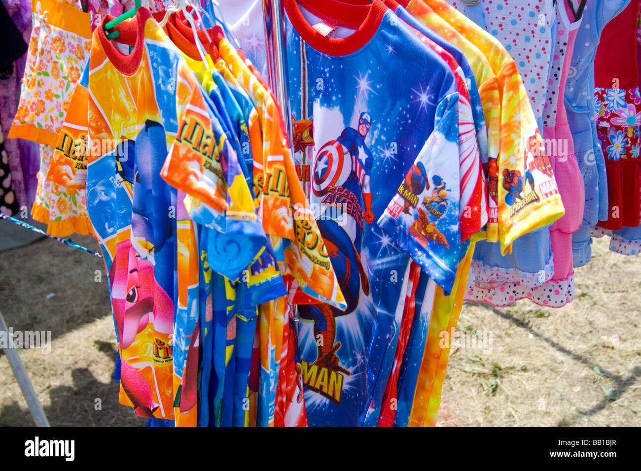 Colorful display of comic book like t-shirts in a Hmong boutique. Hmong ...