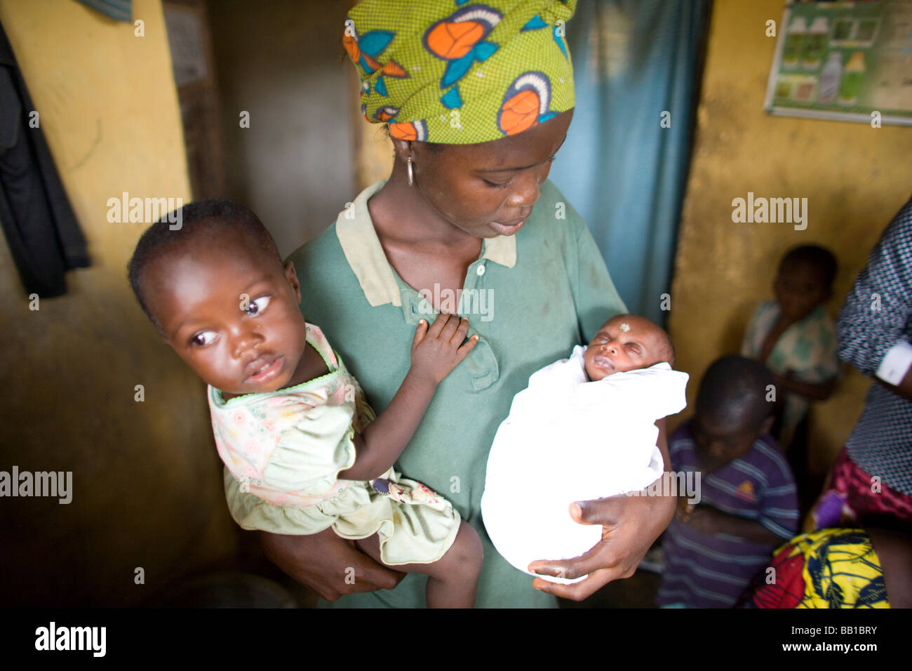 Woman holding babies, Dakoto Junction, Ghana, Africa Stock Photo - Alamy