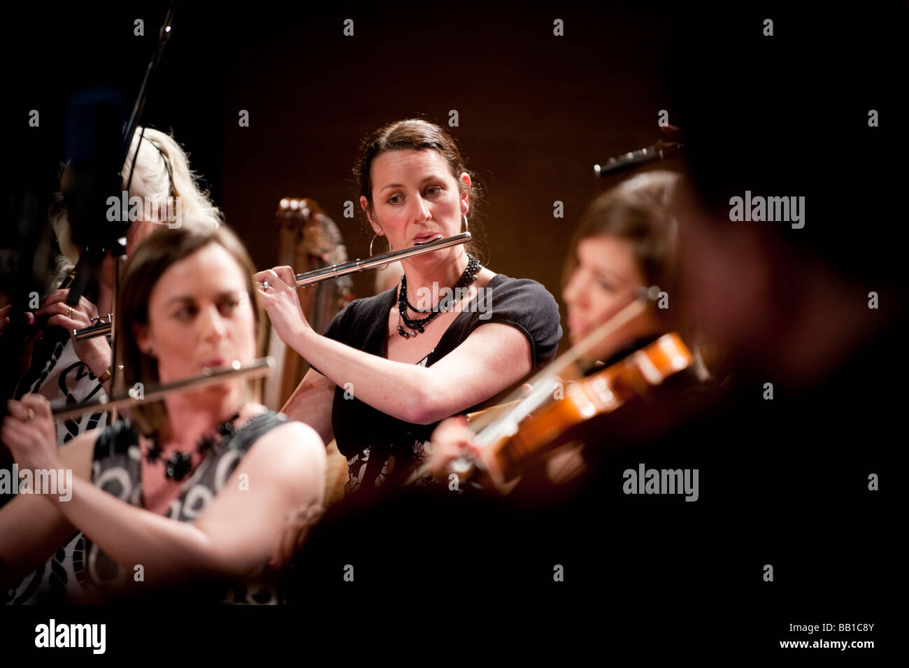 A Woman playing the flute in the Welsh folk orchestra Y Clerorfa in ...