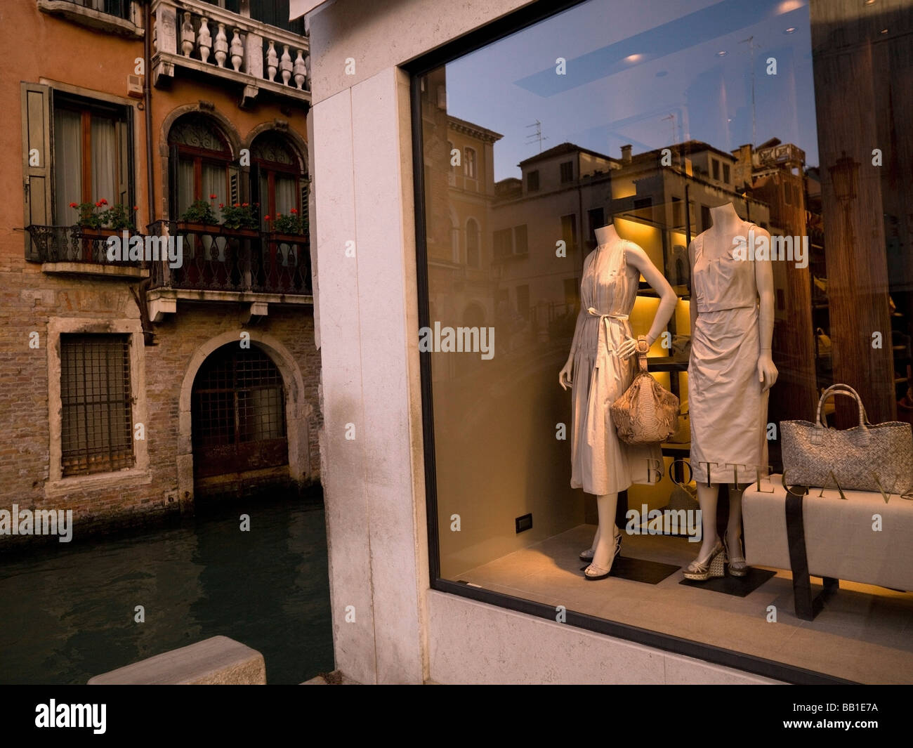 Window display with mannequins next to canal; Venice, Italy Stock Photo ...