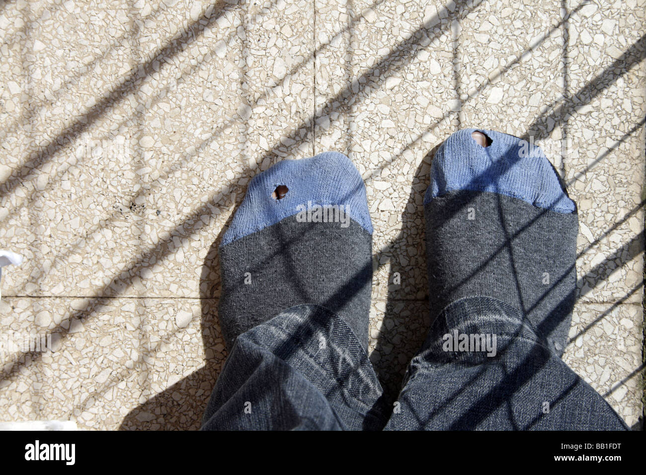 Feet socks hole toe foot hi-res stock photography and images - Alamy