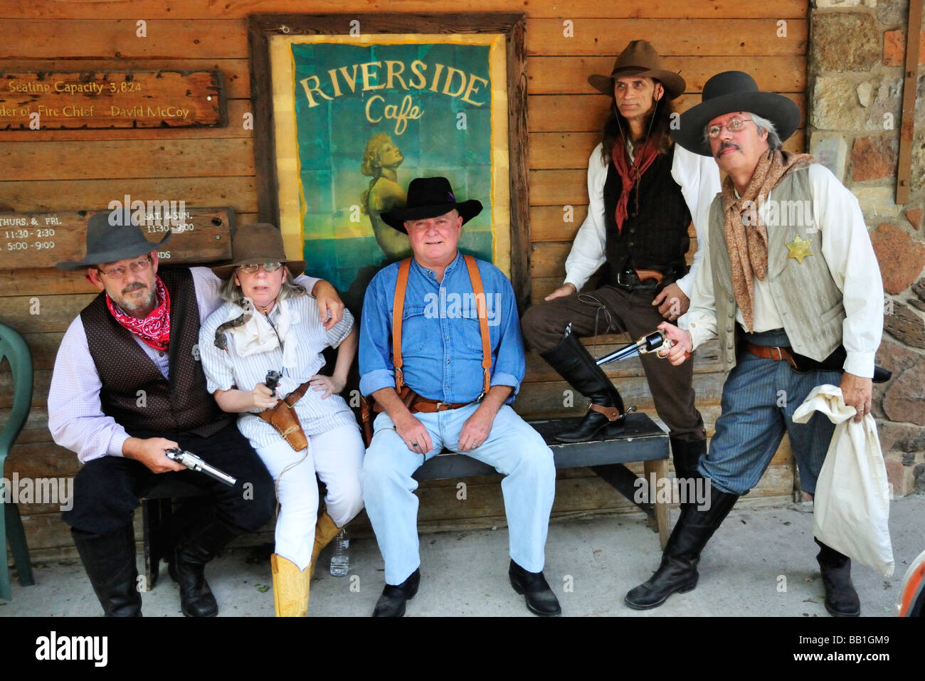 A group of actors impersonating robbers in front of the Riverside Cafe ...